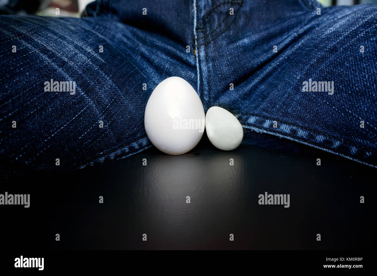 The male testicles, in the form of chicken eggs, between the legs of ...