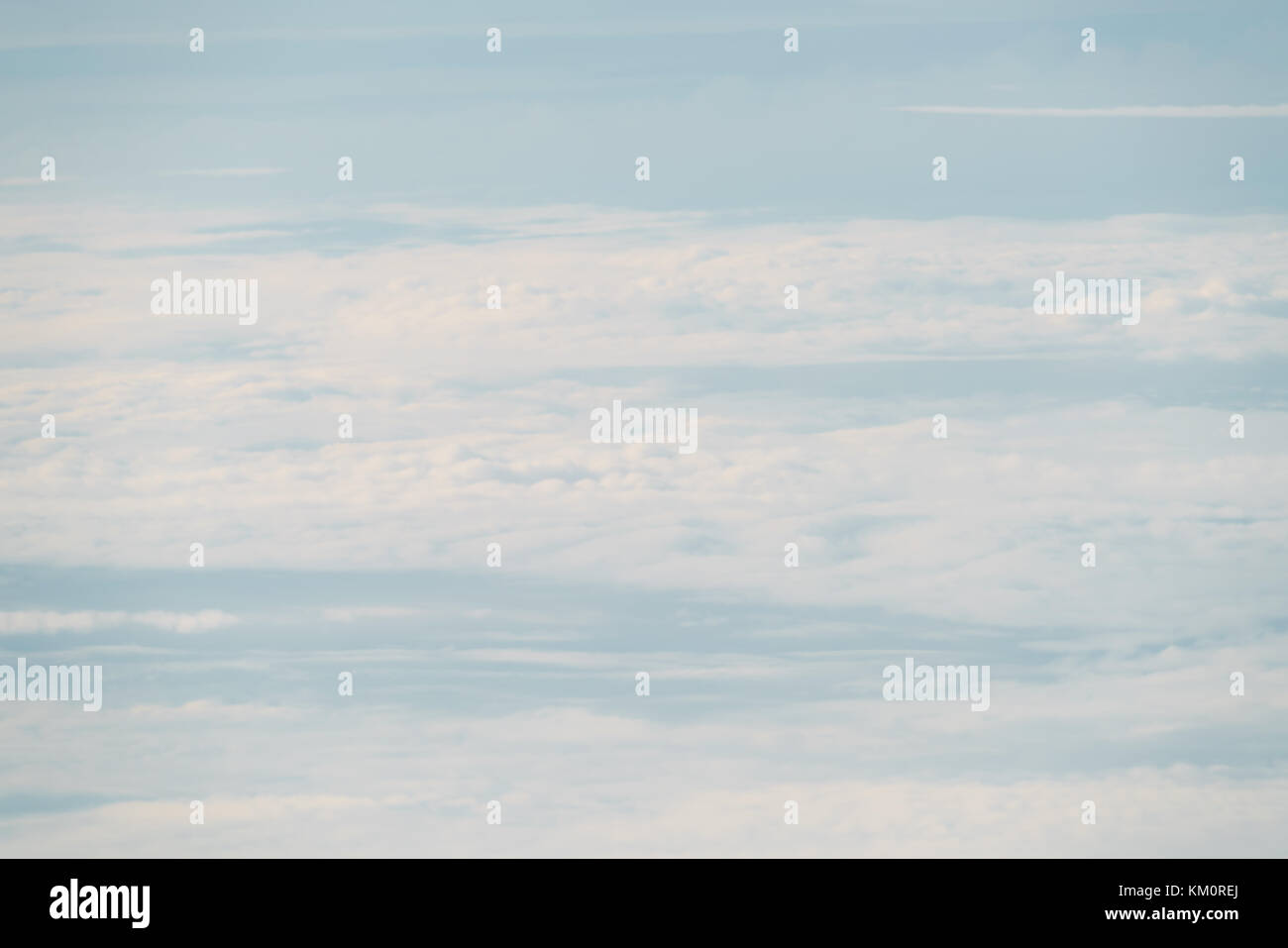 aerial shot from plane flying above the clouds in daytime, plane travel ...