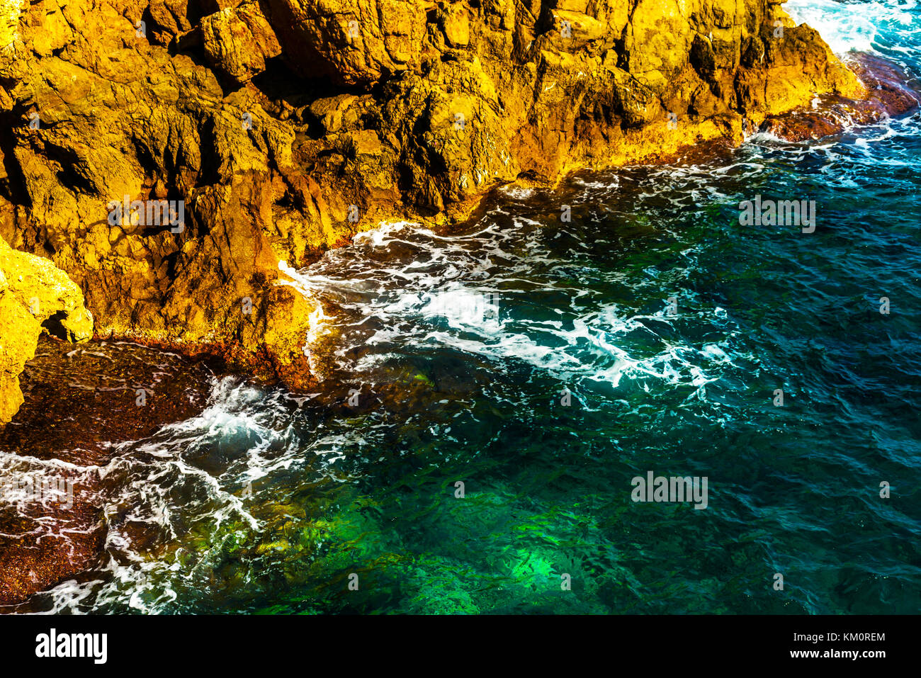 high cliff above the sea, summer sea background, many splashing waves ...