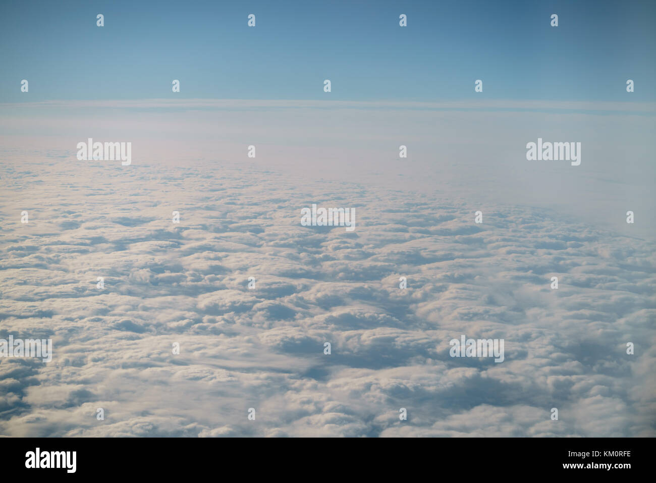aerial shot from plane flying above the clouds in daytime, plane travel ...