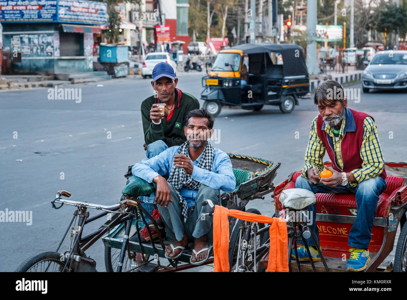 Local cycle rickshaw drivers resting in the street on their rickshaws ...