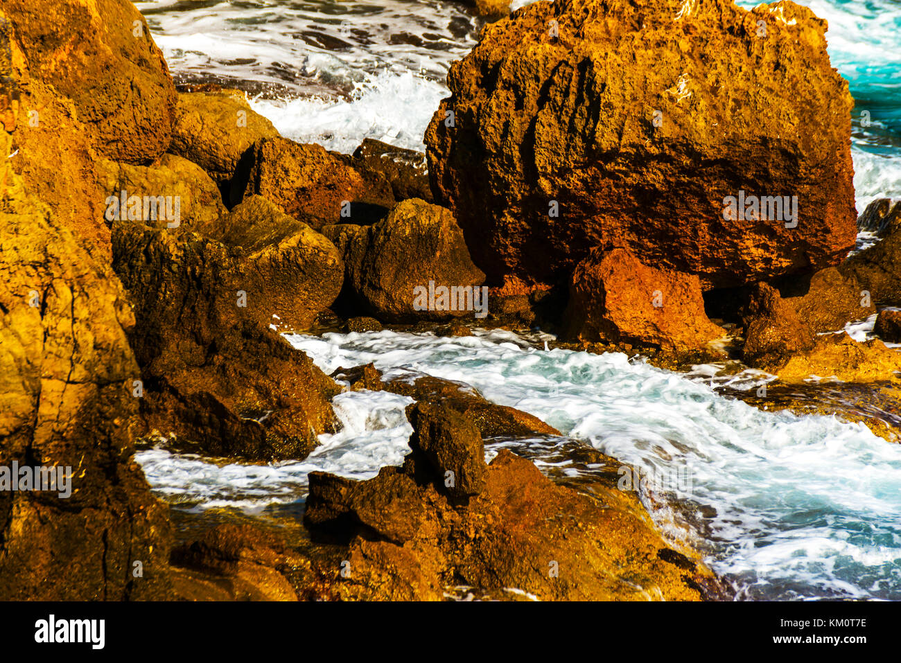 high cliff above the sea, summer sea background, many splashing waves ...