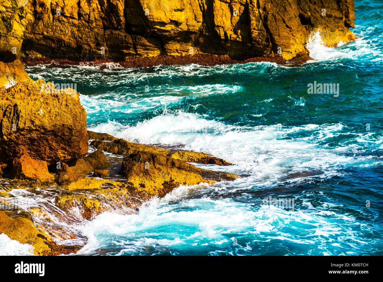 high cliff above the sea, summer sea background, many splashing waves ...