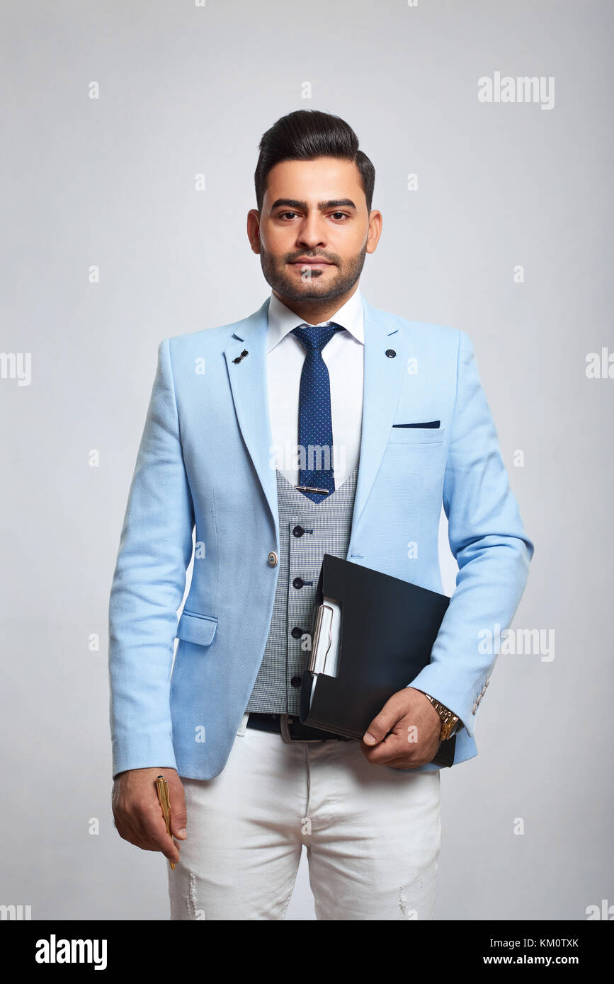 Handsome young businessman clipboard hi-res stock photography and ...