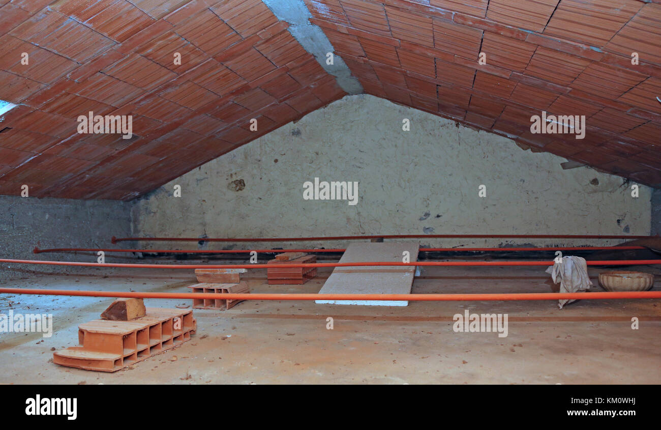 empty attic of the house with sloping roof and rough bricks Stock Photo ...
