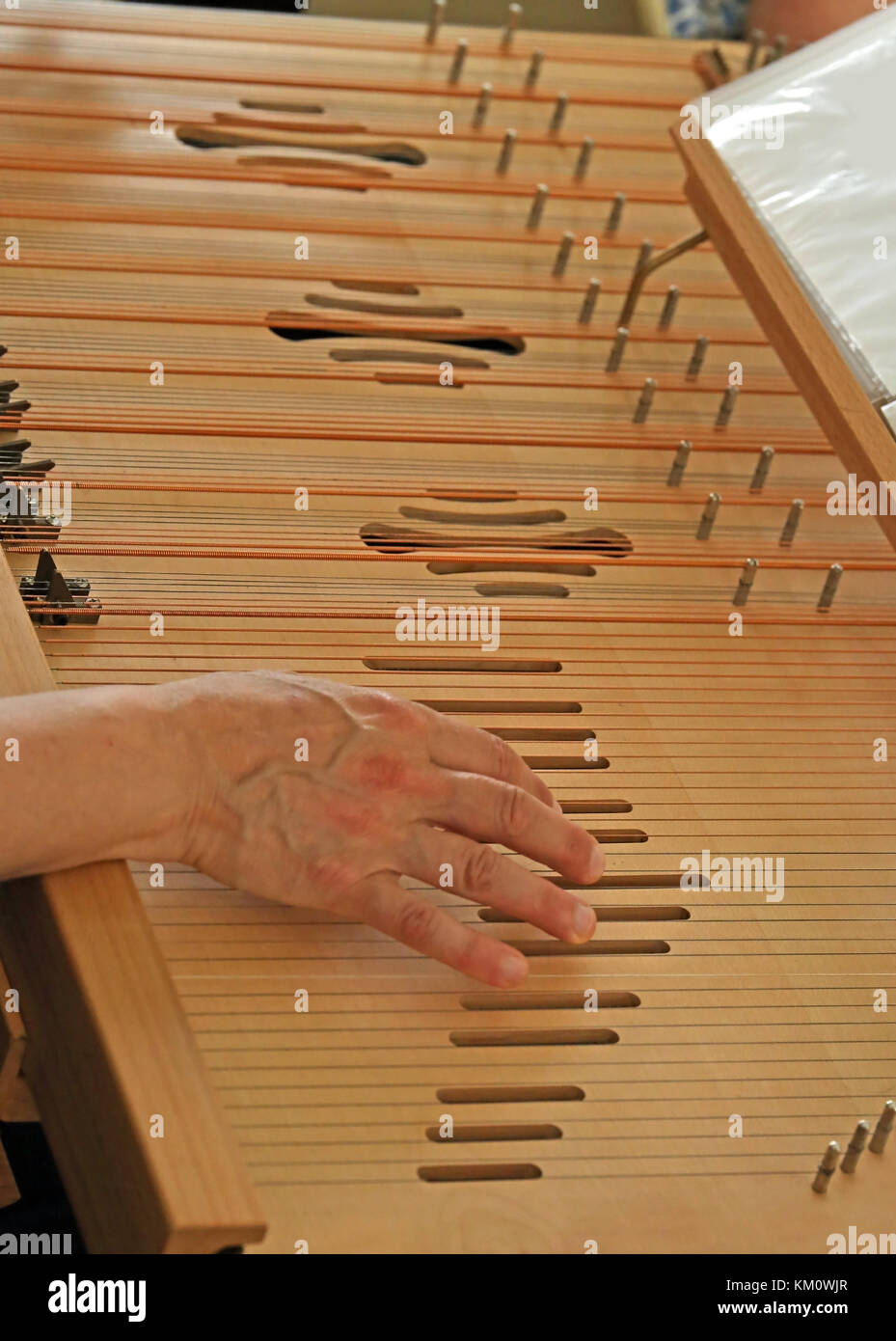 hand of a woman cithara player with lots of strings Stock Photo - Alamy