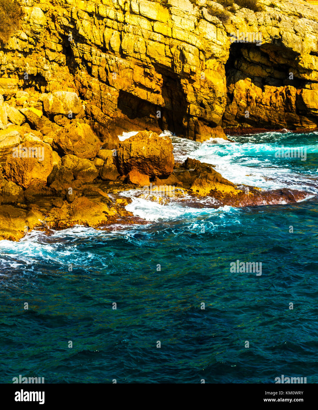 high cliff above the sea, summer sea background, many splashing waves ...