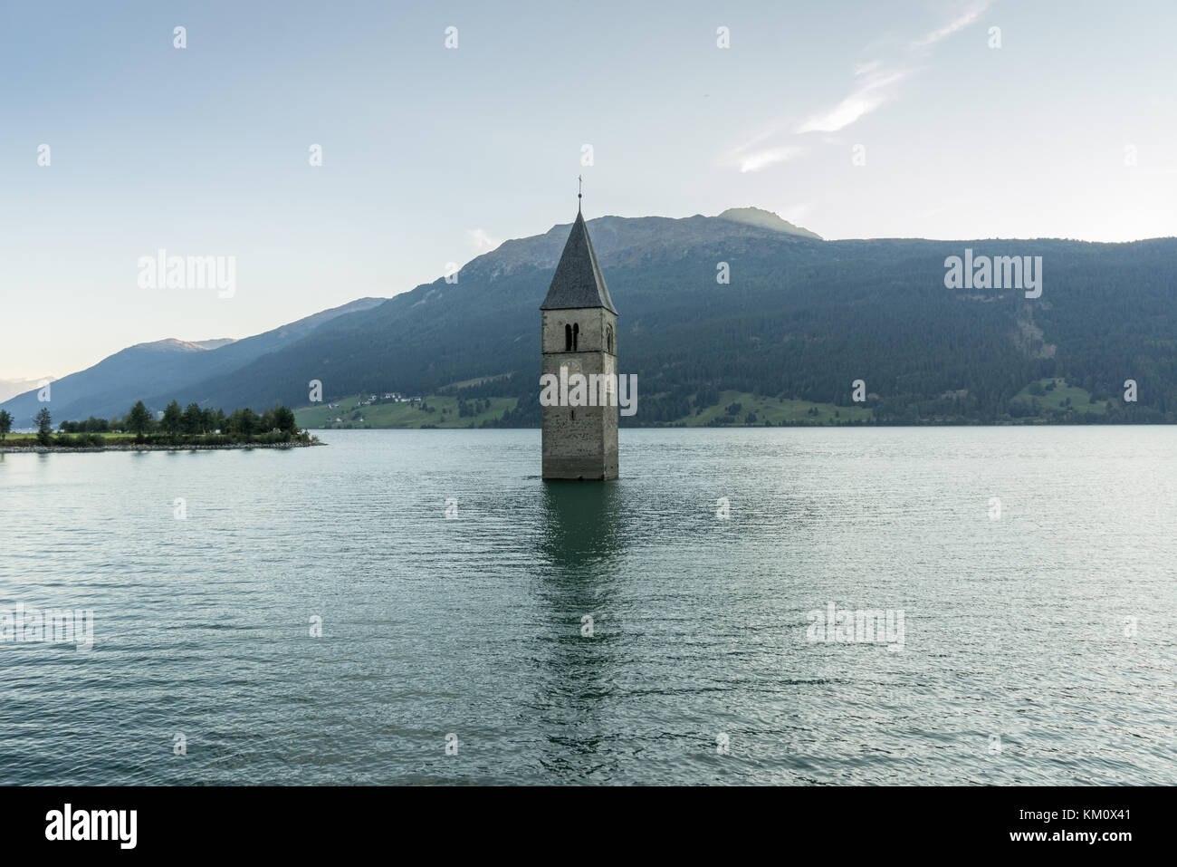 Church under water, drowned village, mountains landscape and peaks in ...