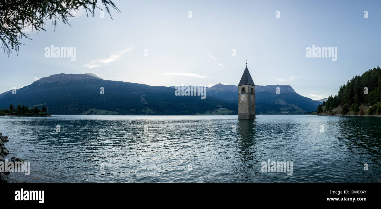 Church under water, drowned village, mountains landscape and peaks in ...