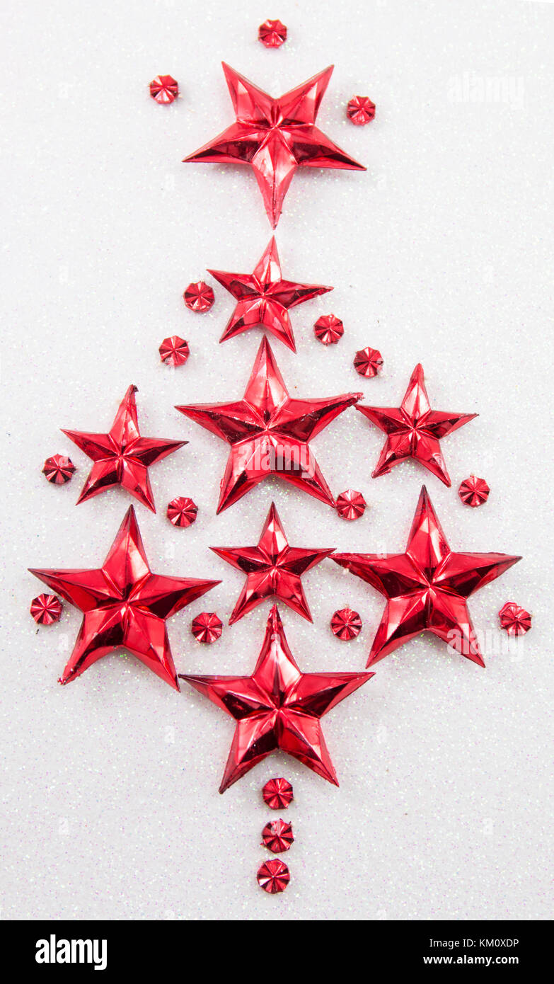 Christmas tree shape made of red star shaped ornaments Stock Photo - Alamy
