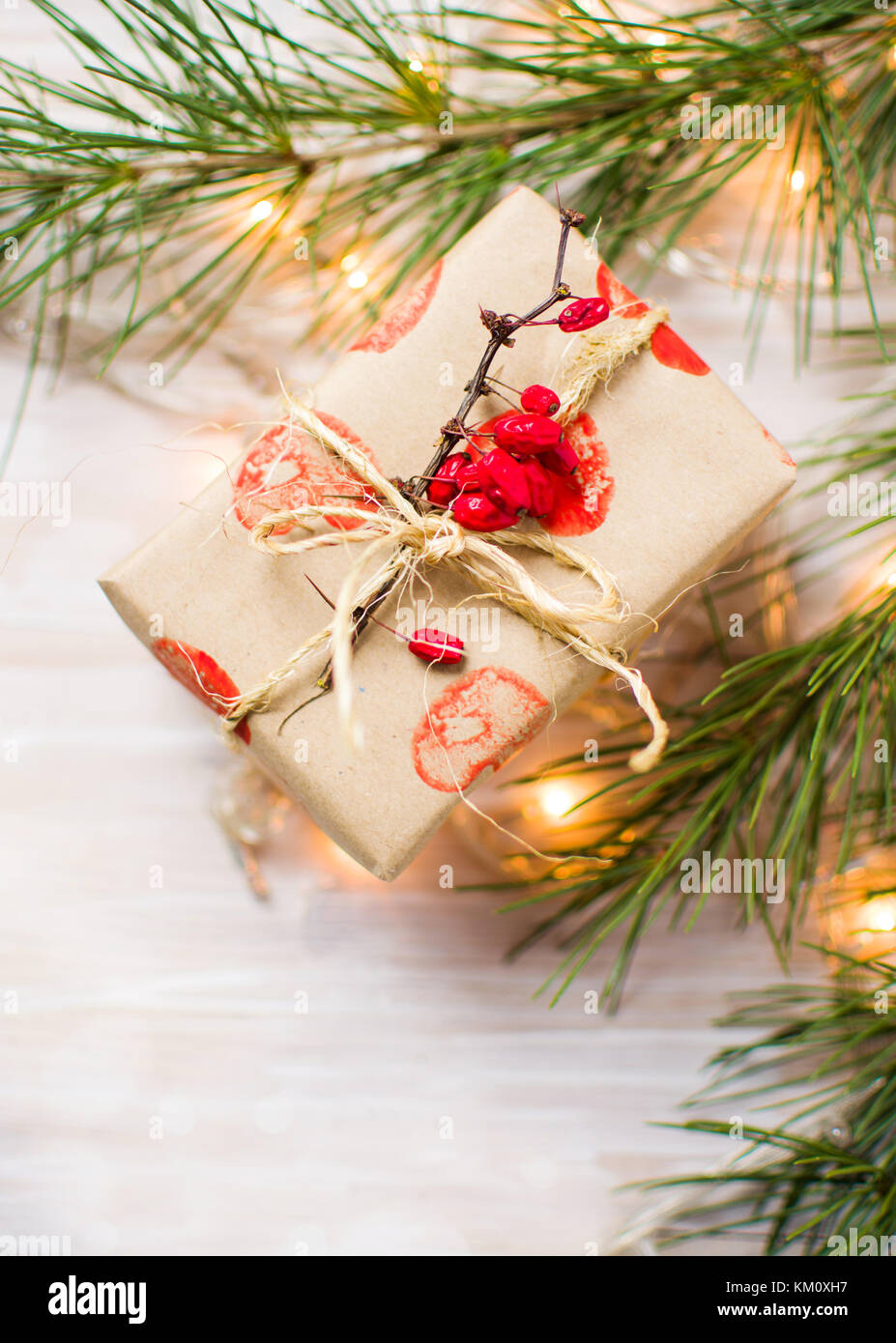 Christmas present and festive lights with fir tree Stock Photo - Alamy
