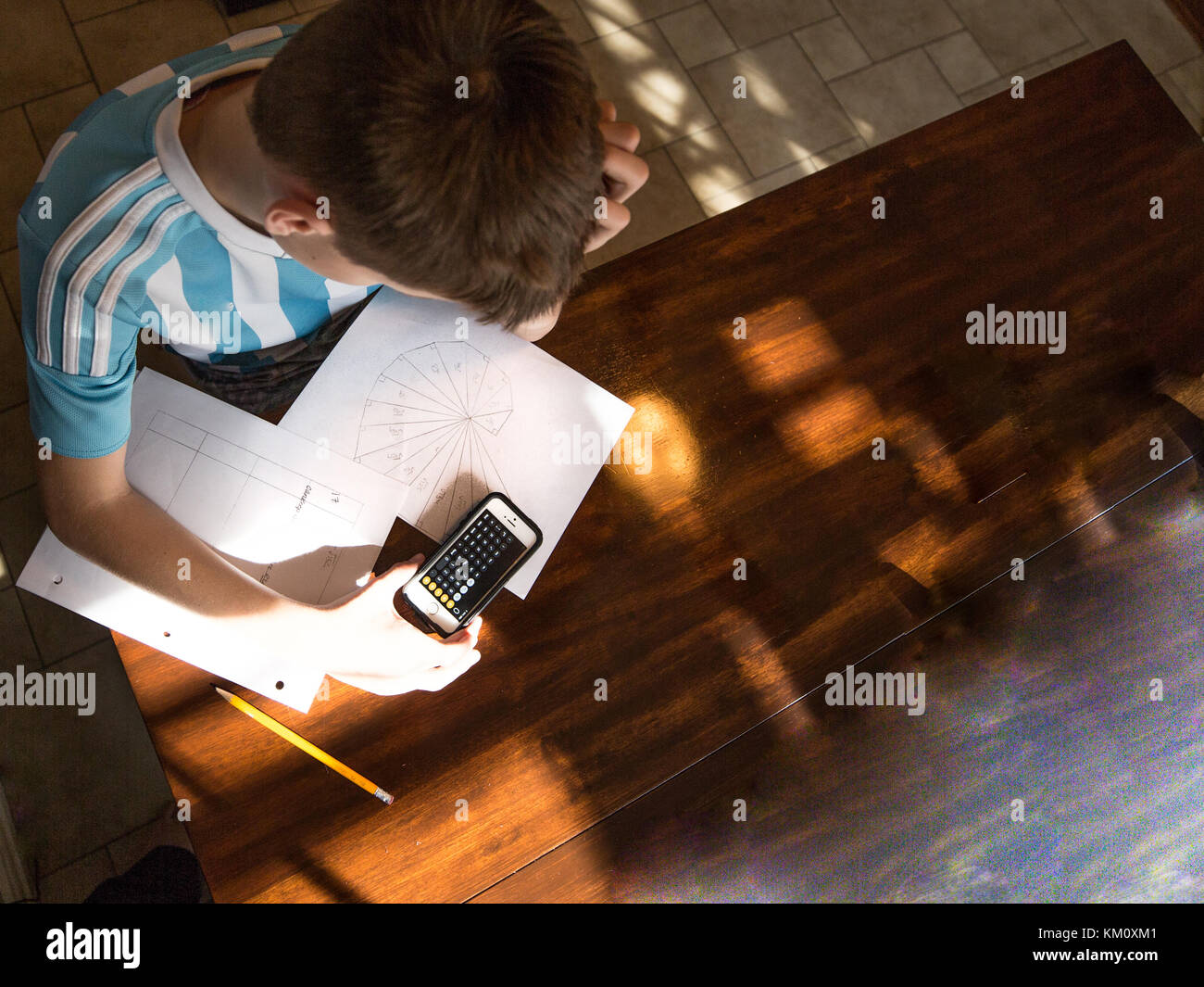 Young kid struggling with mathematics homework assignments with ...