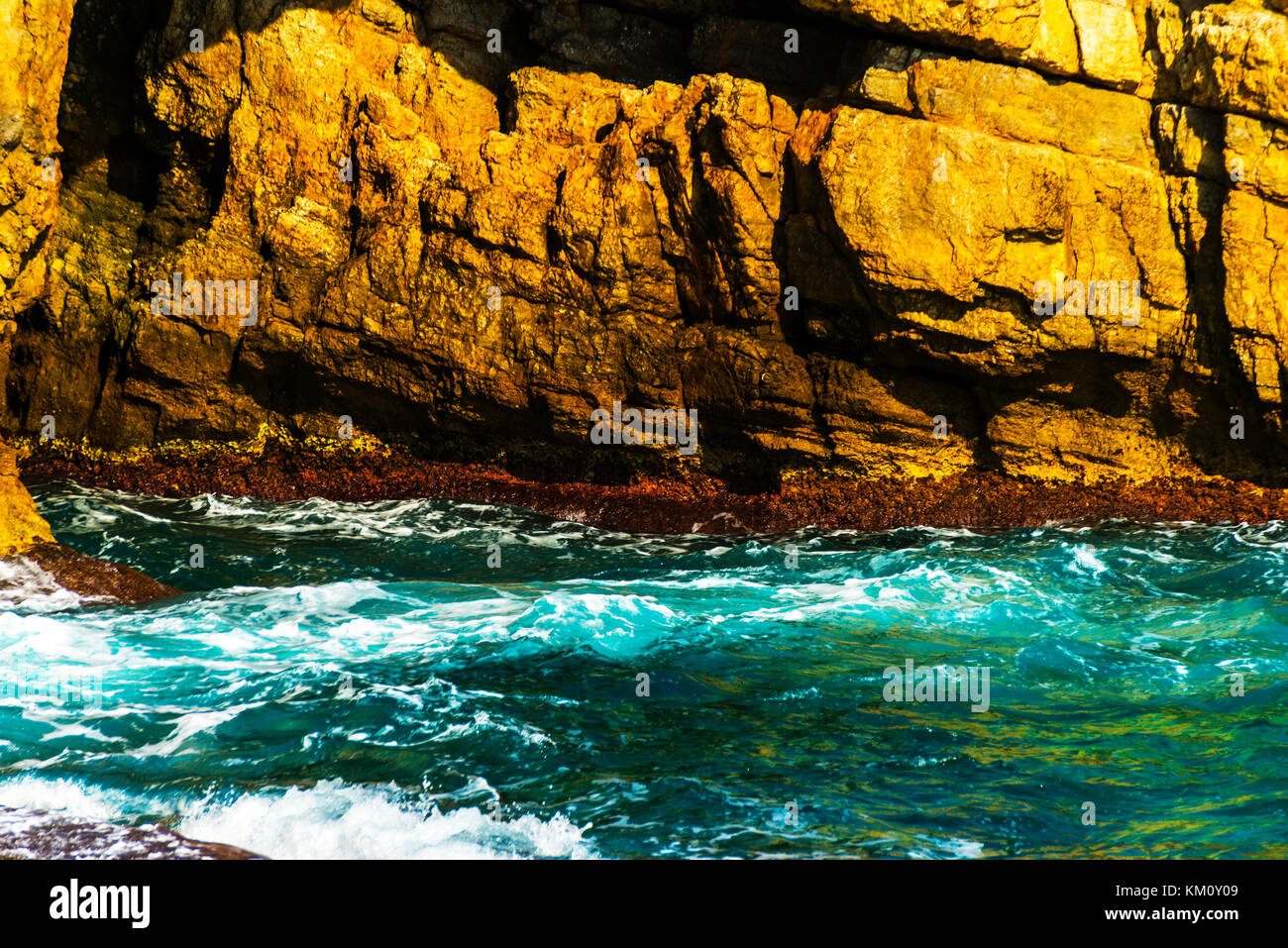 high cliff above the sea, summer sea background, many splashing waves ...