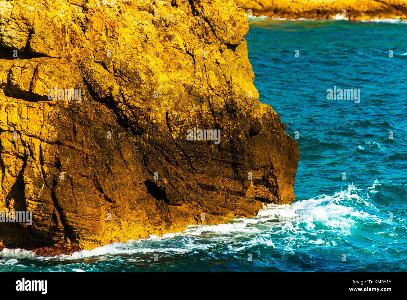 high cliff above the sea, summer sea background, many splashing waves ...