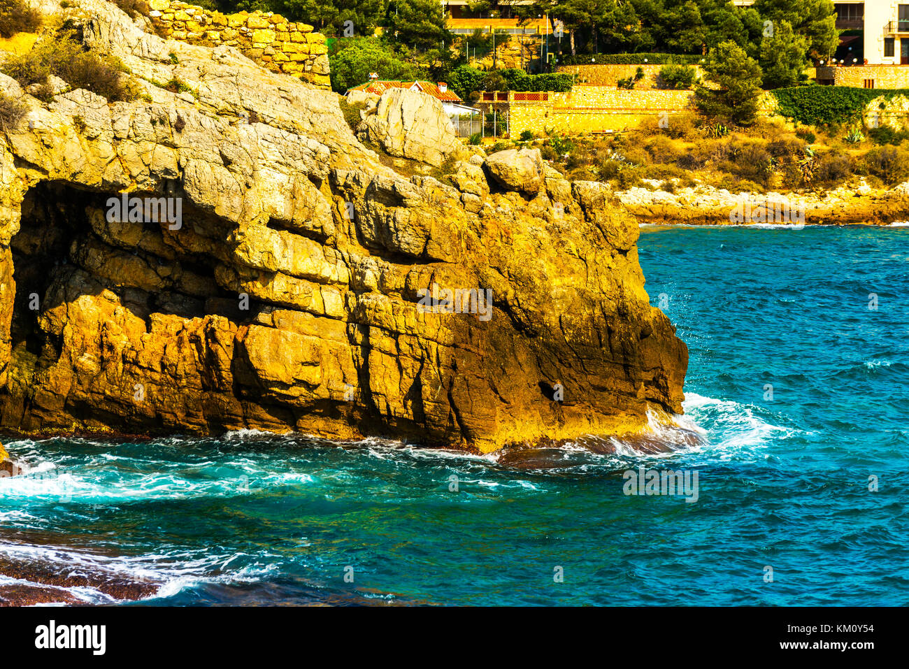 high cliff above the sea, summer sea background, many splashing waves ...