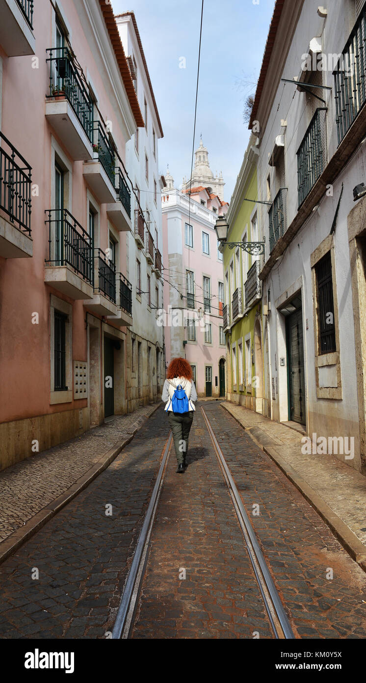 Colorful street in Alfama quarter, old picturesque part of Lisbon ...