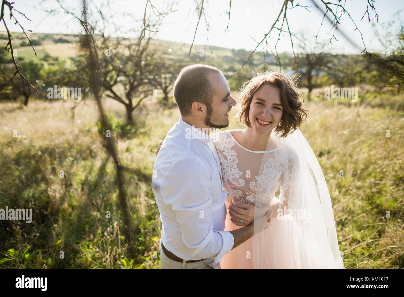 Young Bride and Groom couple in garden. Love and tenderness Stock Photo ...