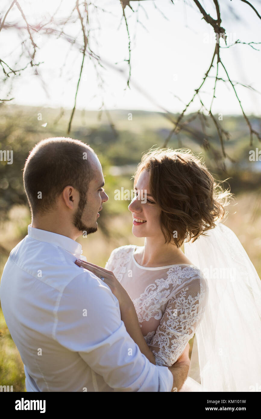 Young Bride and Groom couple in garden. Love and tenderness Stock Photo ...