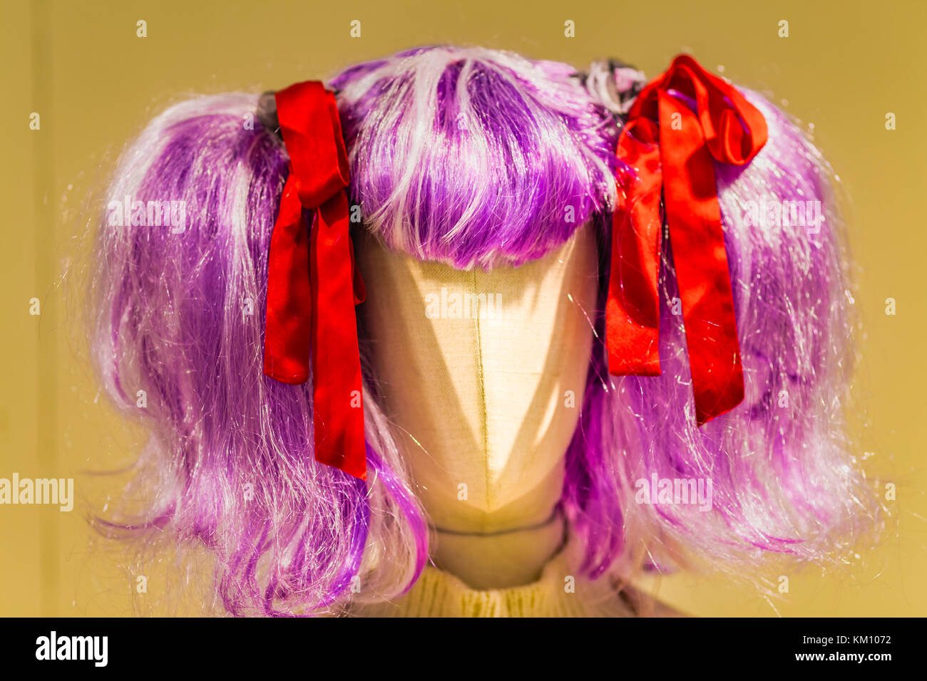 manga style teenage dummy with pink hair and red ribbons Stock Photo ...