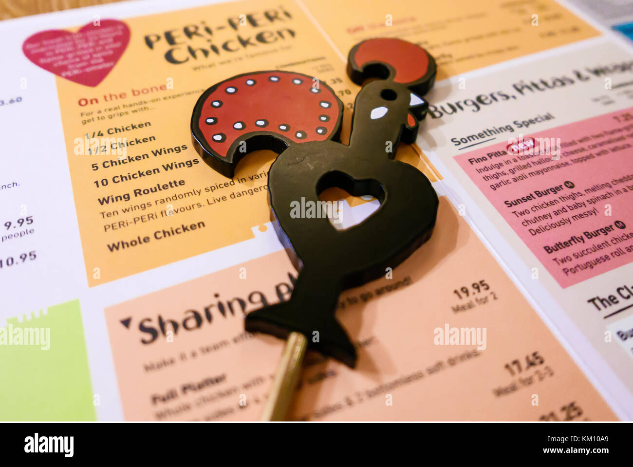 Nando's Chicken table marker with a menu Stock Photo - Alamy