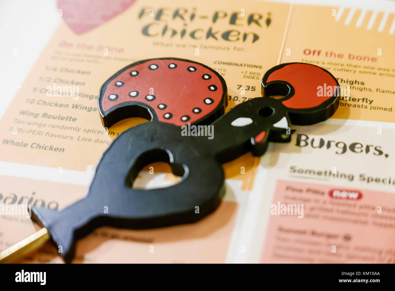Nando's Chicken table marker with a menu Stock Photo - Alamy