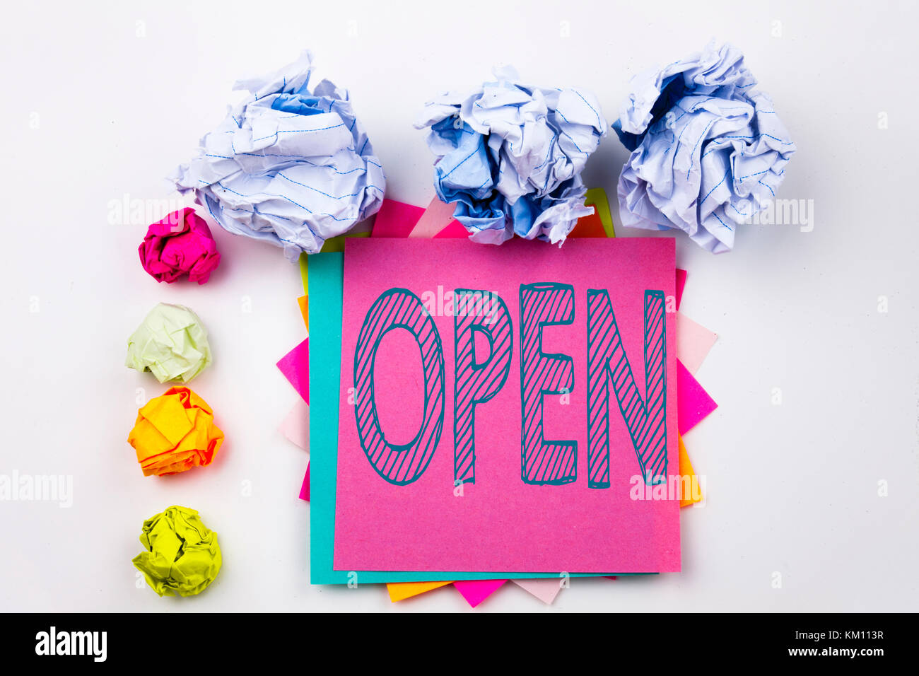 Writing text showing Open written on sticky note in office with screw ...