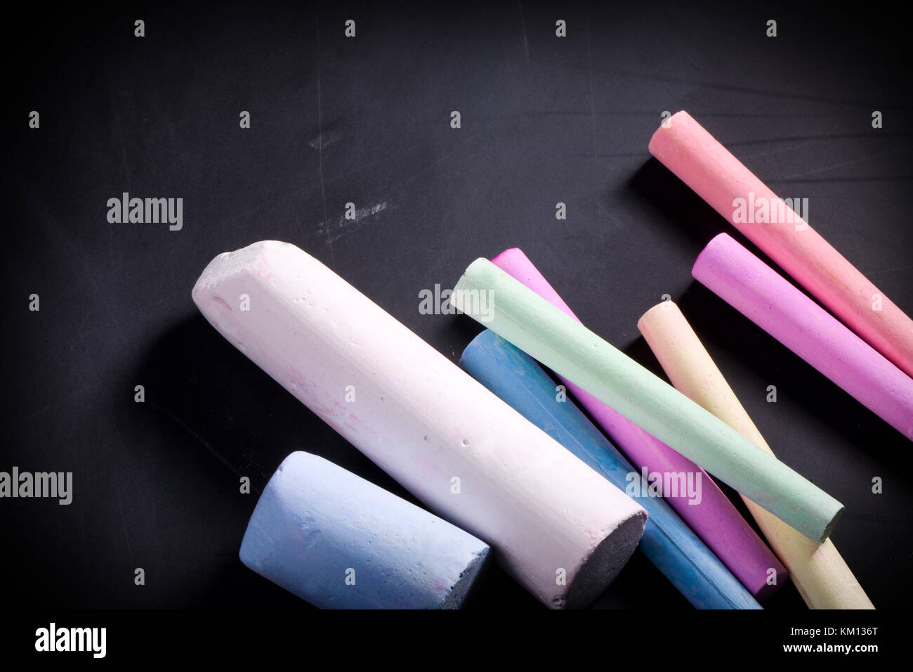 Colorful school chalk on black board Stock Photo - Alamy