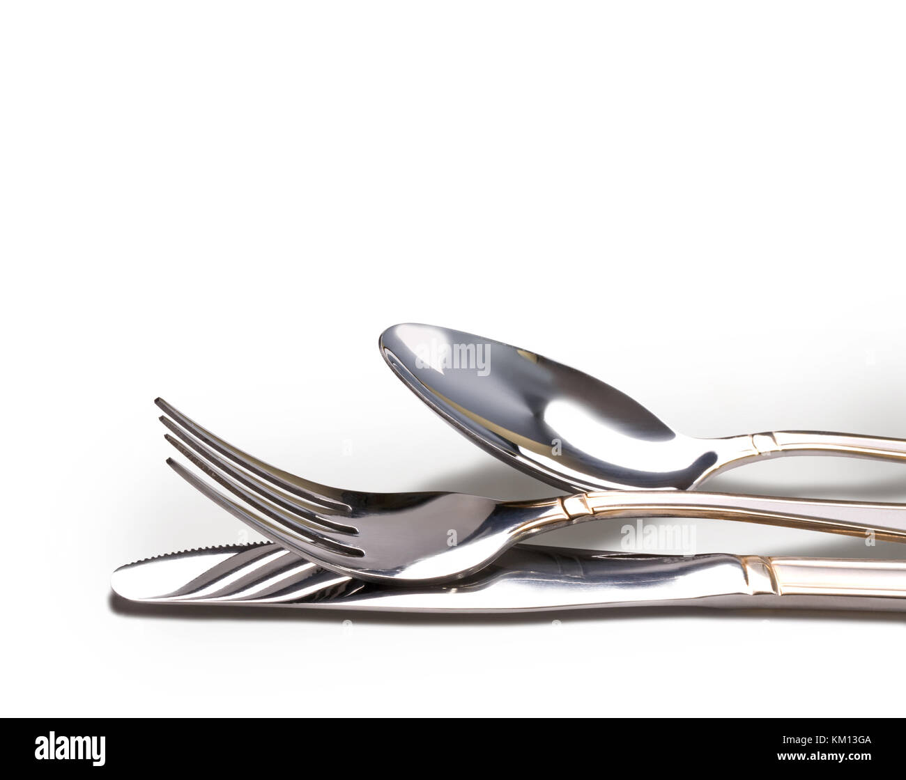 Knife, fork and spoon isolated on white Stock Photo - Alamy