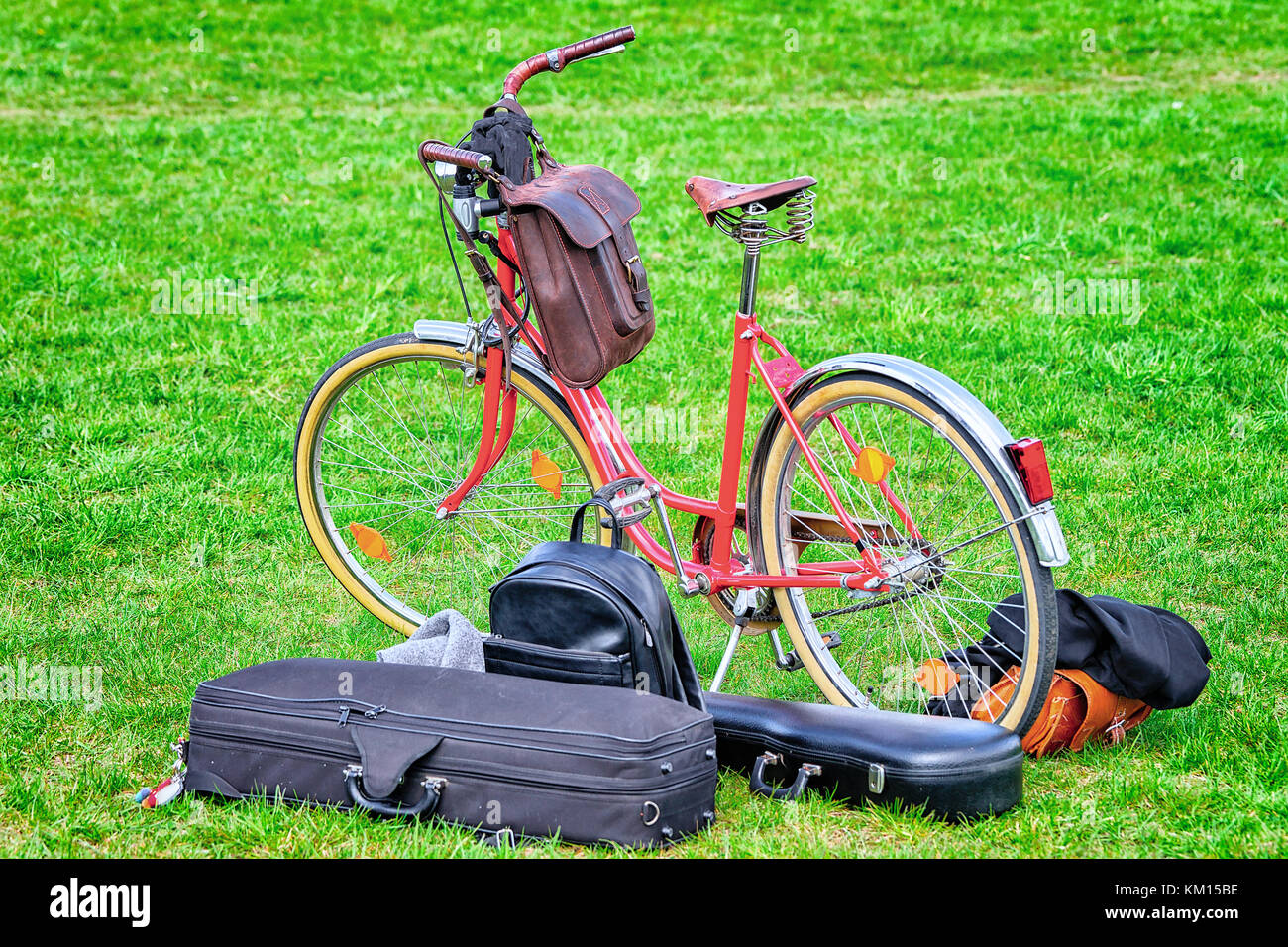 City bicycle and boxes for musical instruments on the green lawn Stock ...