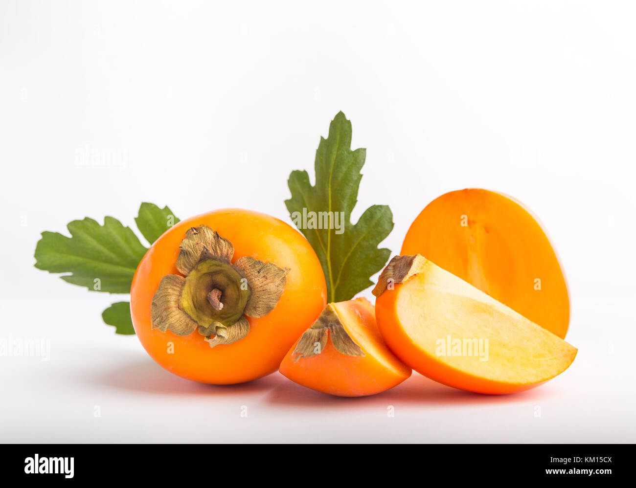 khaki fruit on a white background Stock Photo - Alamy