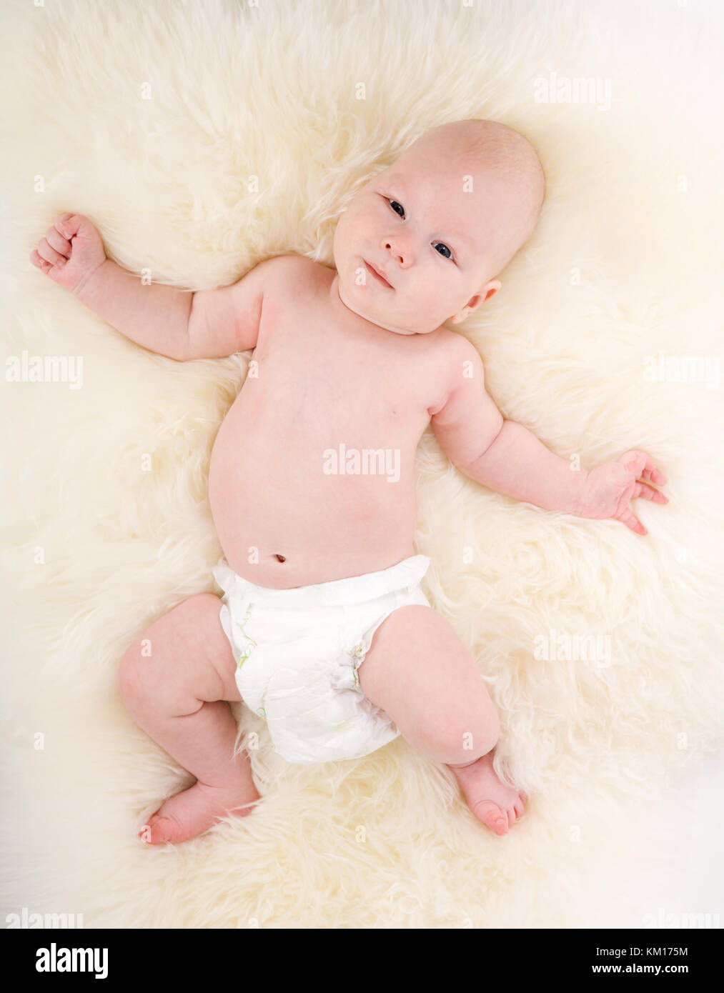Smiling Baby looking up isolated on white Stock Photo - Alamy
