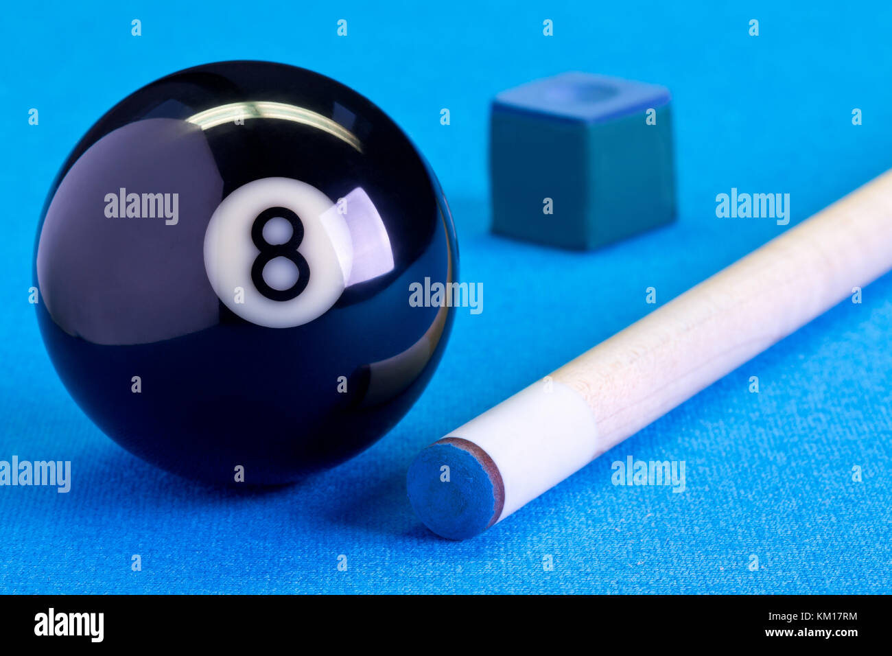 Billiard pool game eight ball with chalk and cue on billiard table with ...