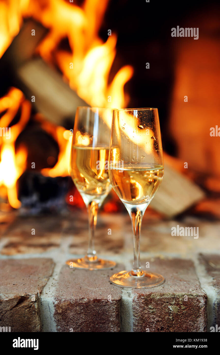 Two glasses of sparkling wine on the background of fire Stock Photo - Alamy