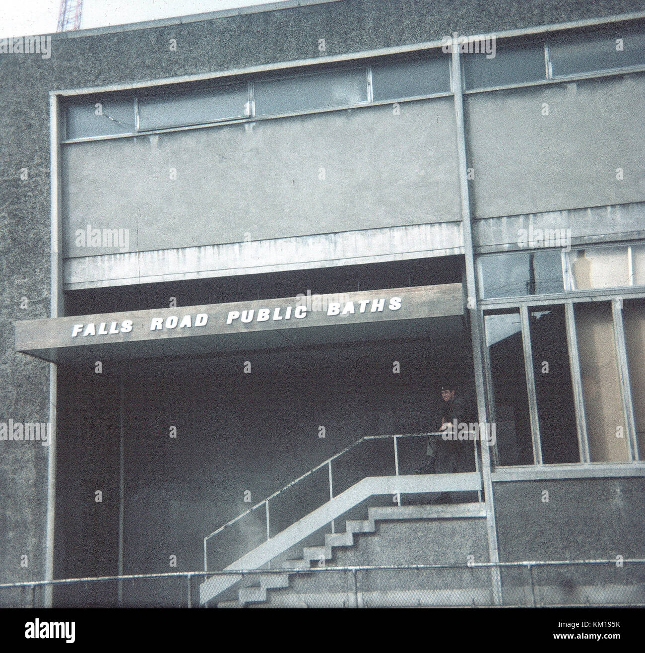british army soldier guarding the falls road public baths in west ...