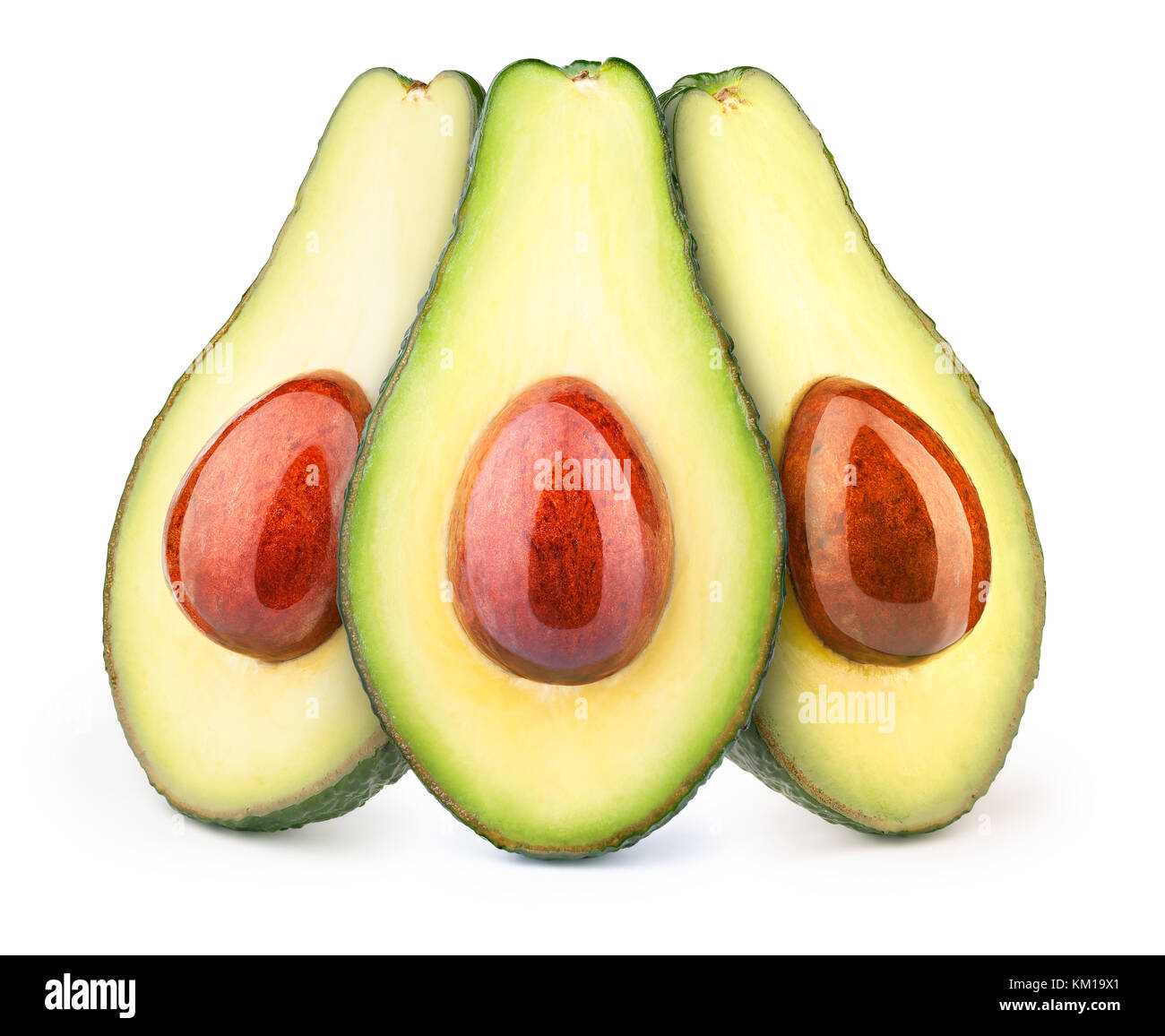 Group of three avocados with oily stones isolated on white, with ...