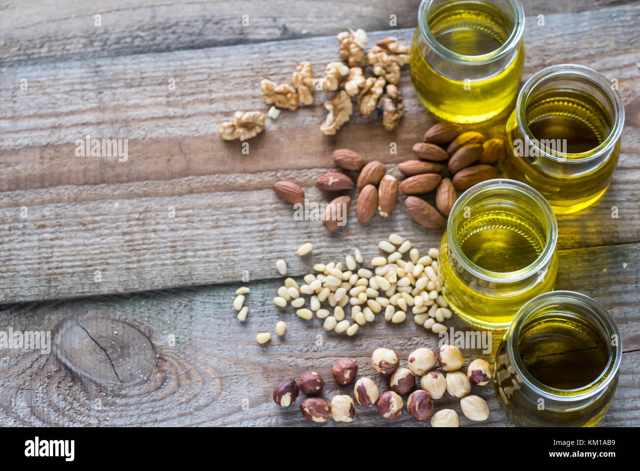 Glass jars with different kinds of nut oil Stock Photo - Alamy