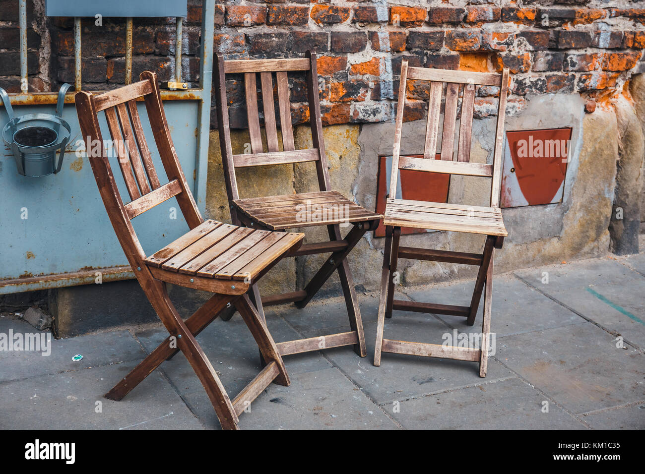 many empty wooden chairs outside the restaurant Stock Photo - Alamy
