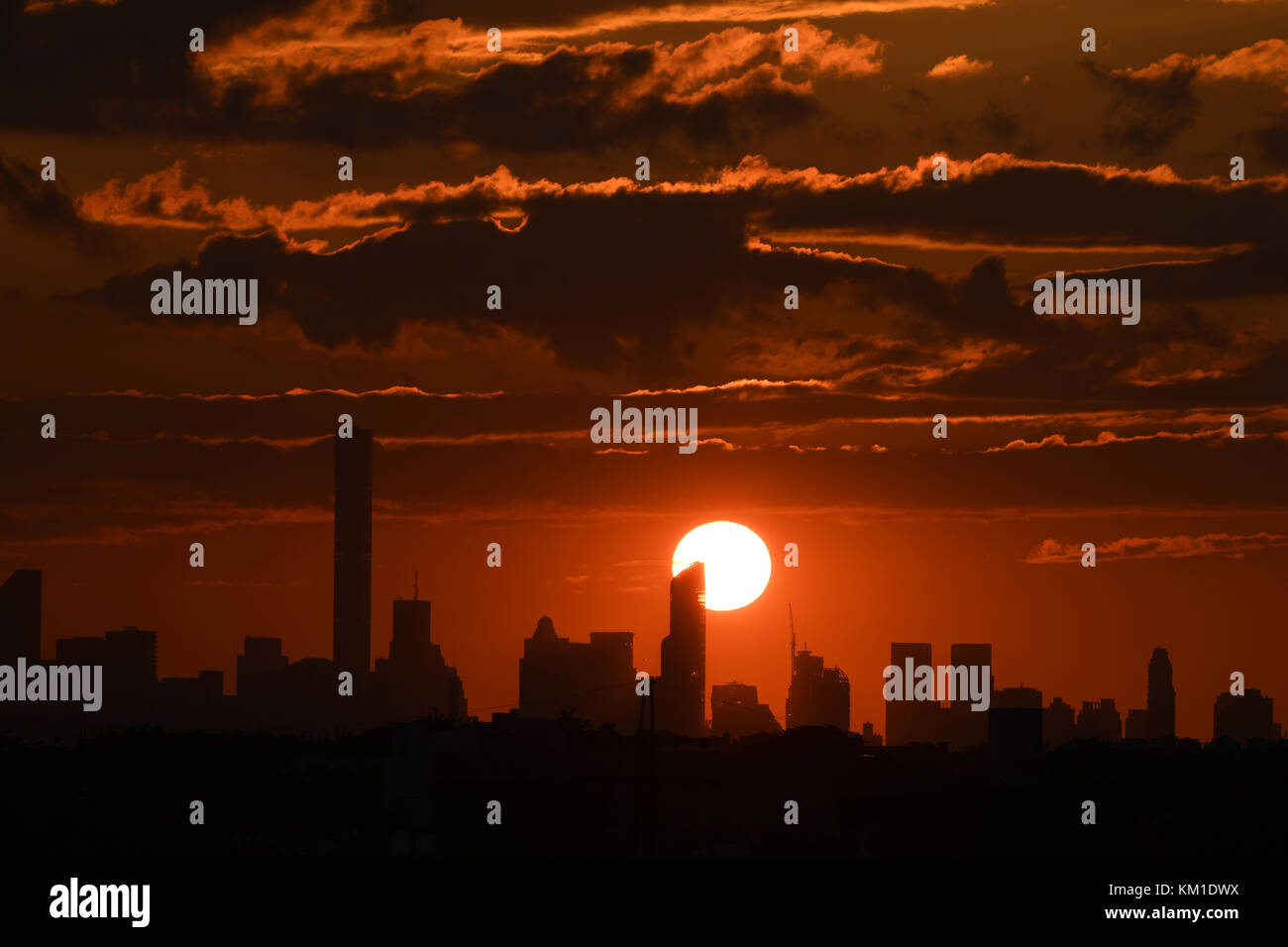 FLUSHING NY- SEPTEMBER 01: Sunset over the Manhattan skyline from ...