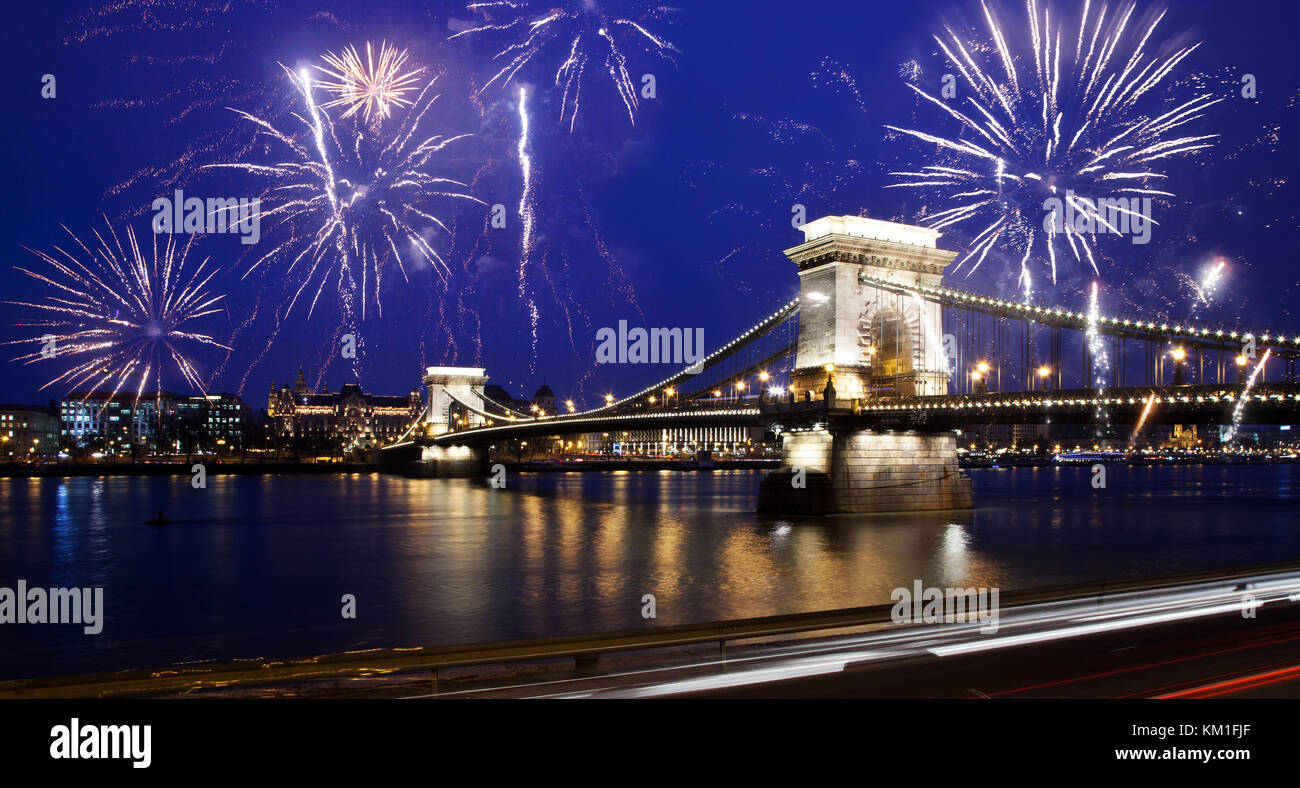 celebrating New Year in the city - Chain bridge with fireworks over the ...
