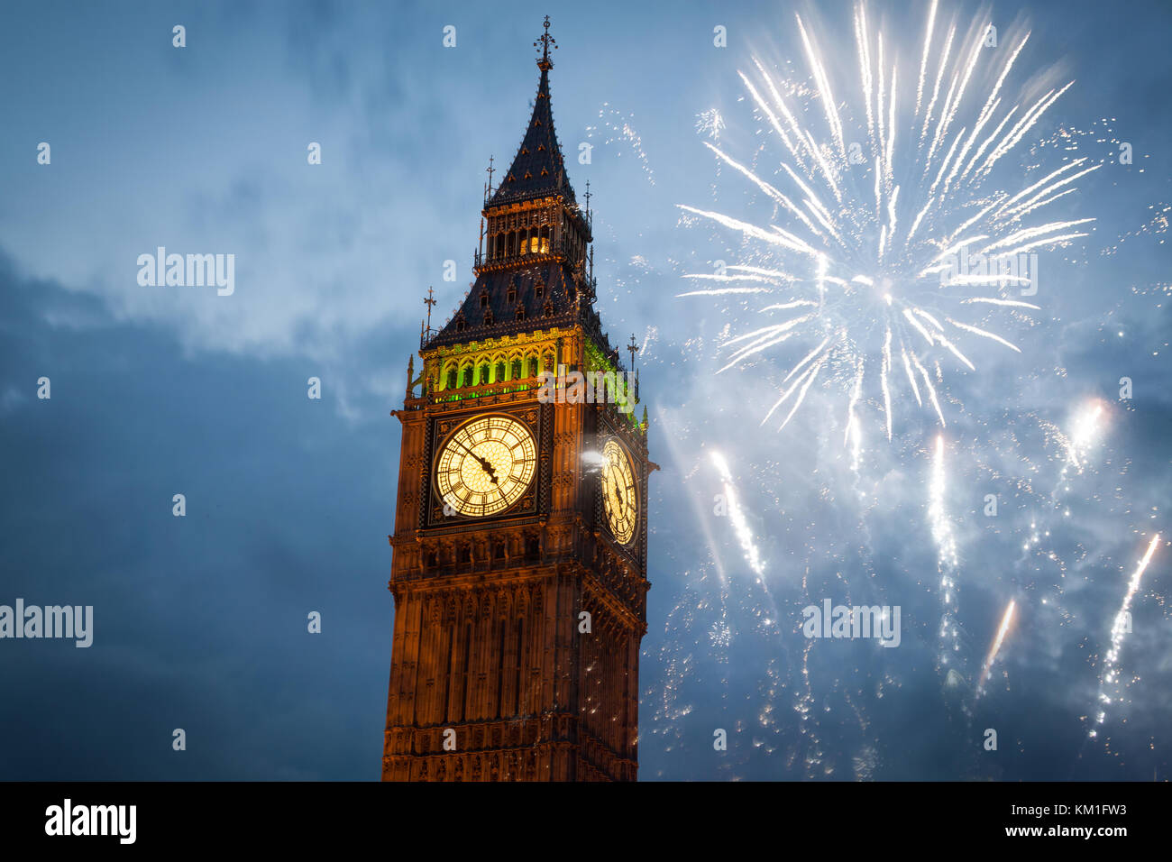 explosive fireworks display fills the sky around Big Ben. New Year's ...