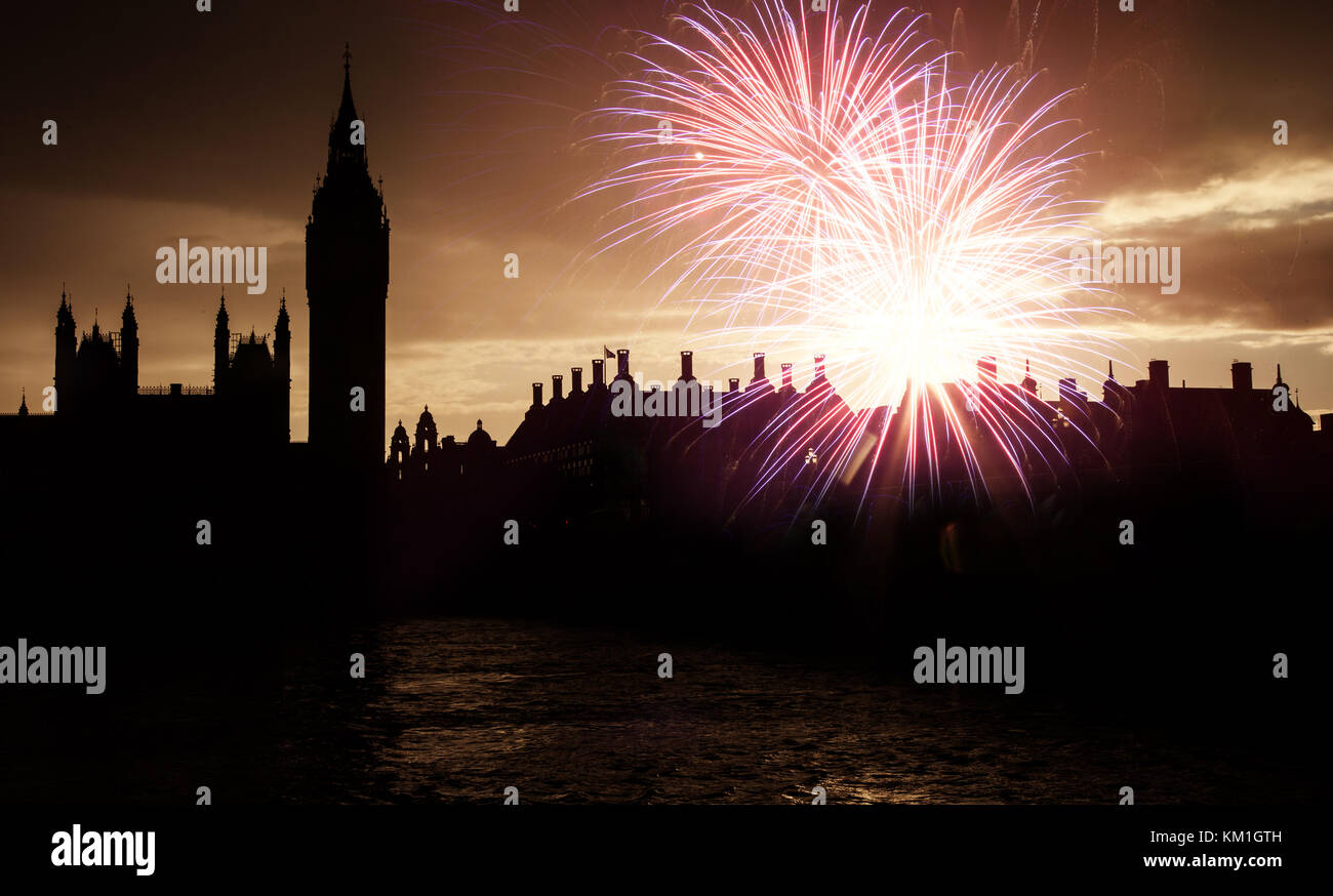 explosive fireworks display fills the sky around Big Ben. New Year's ...