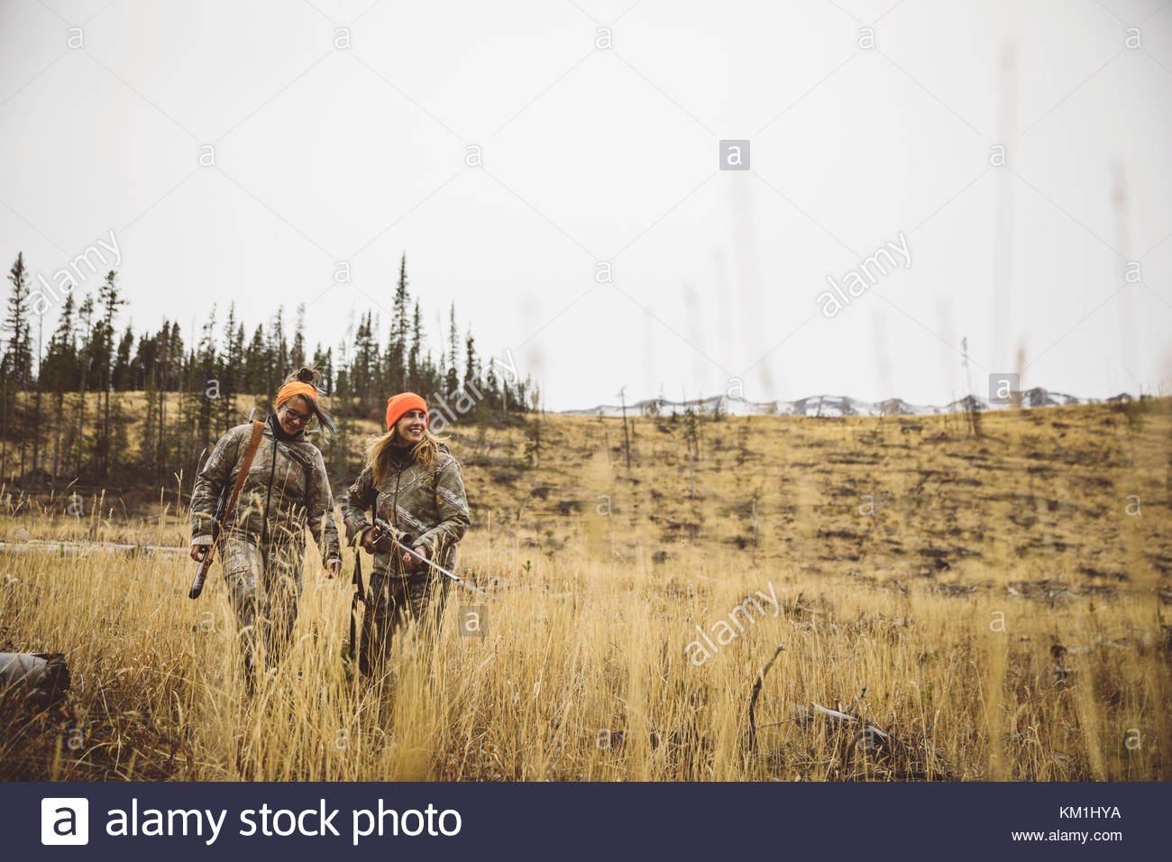 Woman with rifle walking away hi-res stock photography and images - Alamy