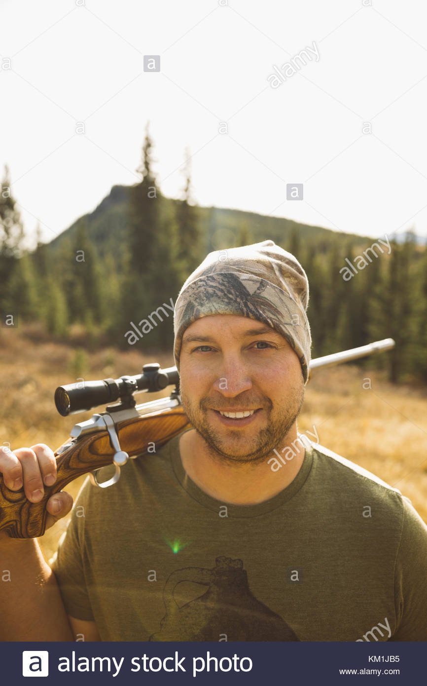 Man holding shotgun hi-res stock photography and images - Alamy