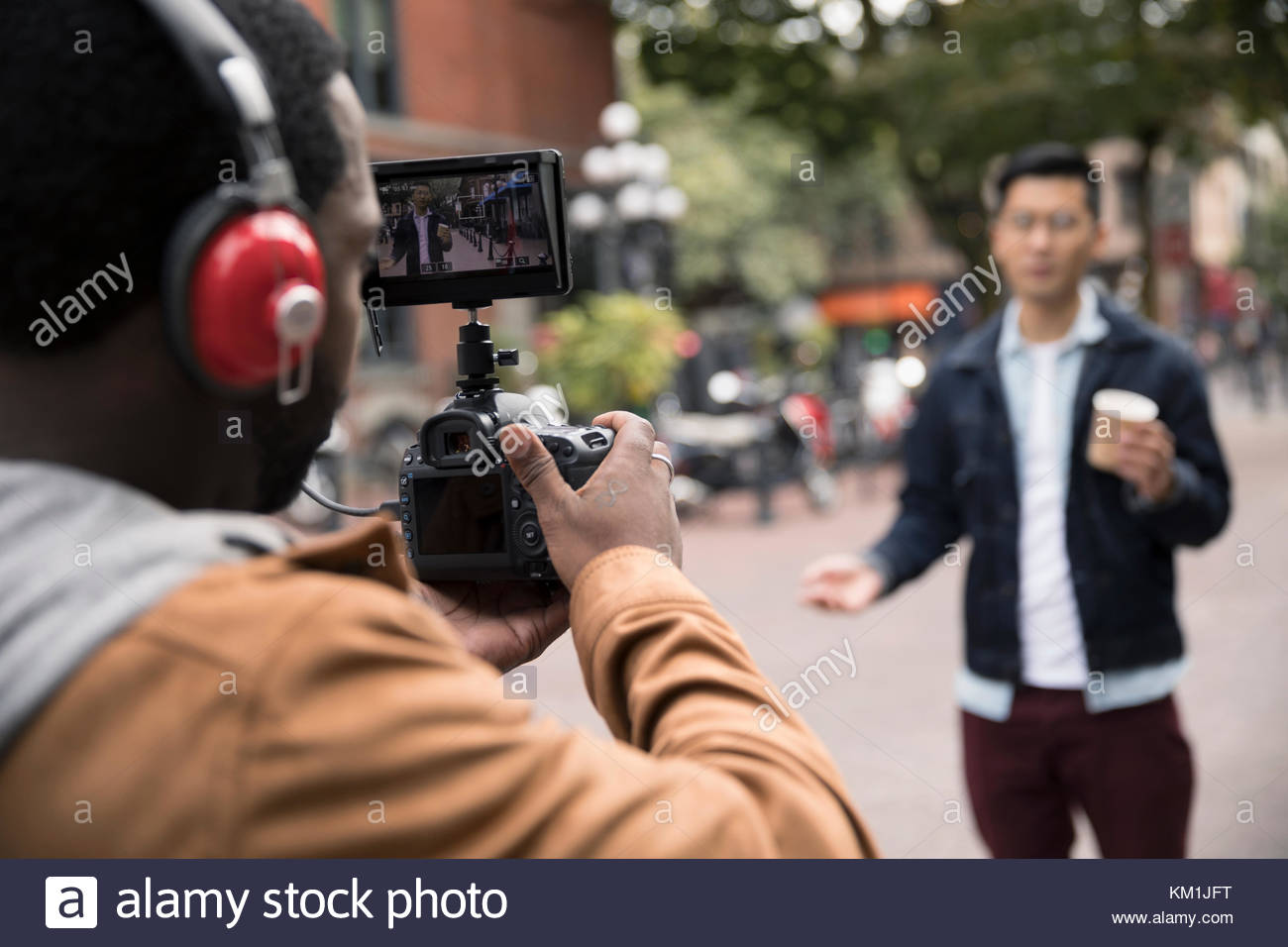 Videoing on street hi-res stock photography and images - Alamy