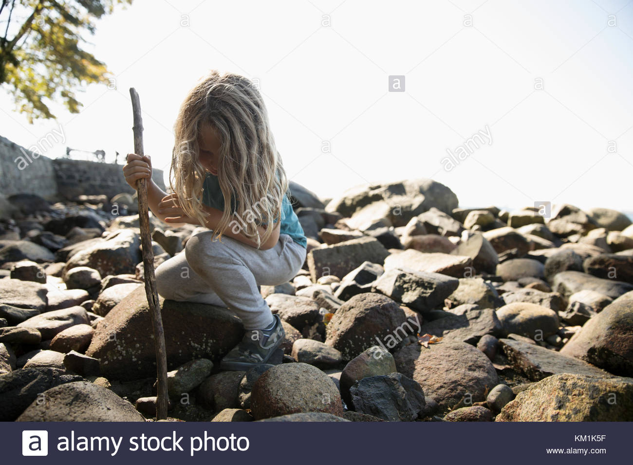 Girl digging with stick hi-res stock photography and images - Alamy