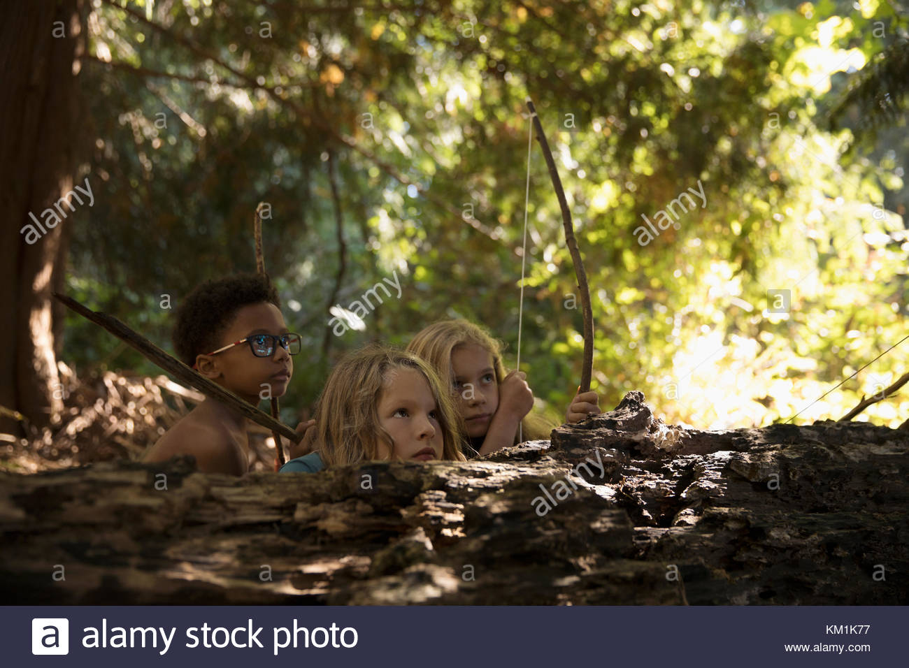 Boy Hiding Behind A Tree