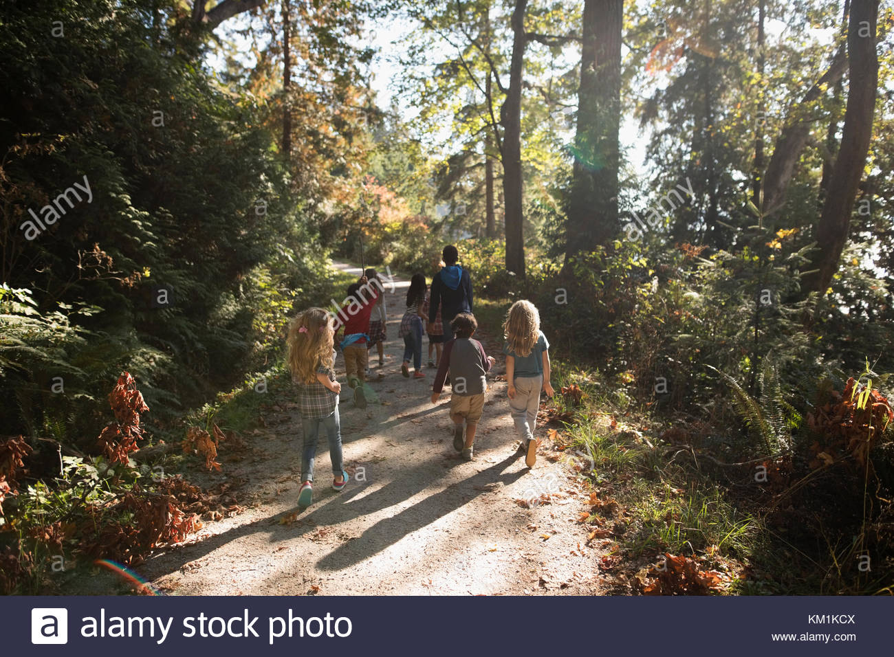 Child running on path rear view hi-res stock photography and images - Alamy