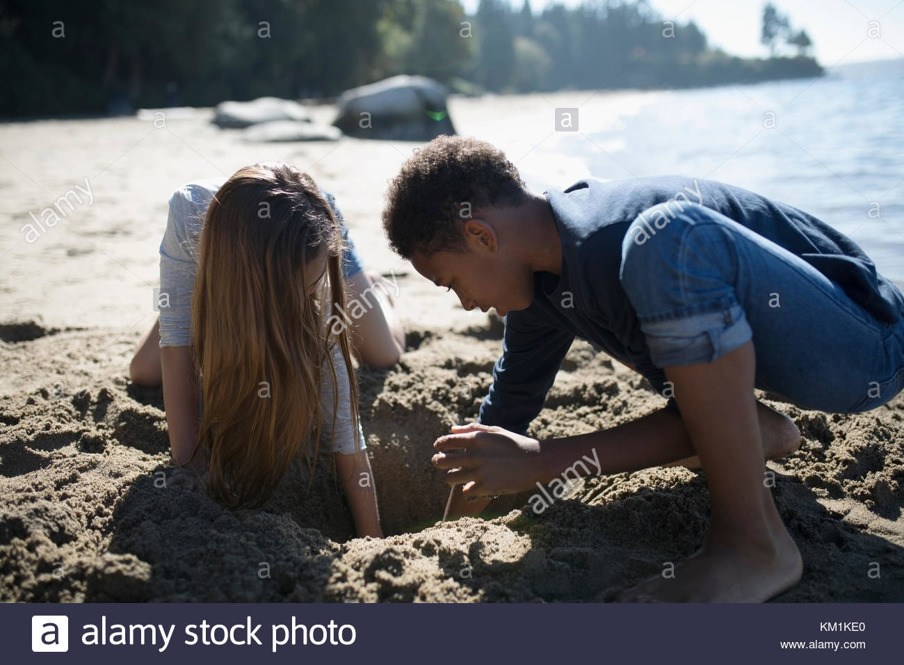 Boy digging sand hi-res stock photography and images - Alamy
