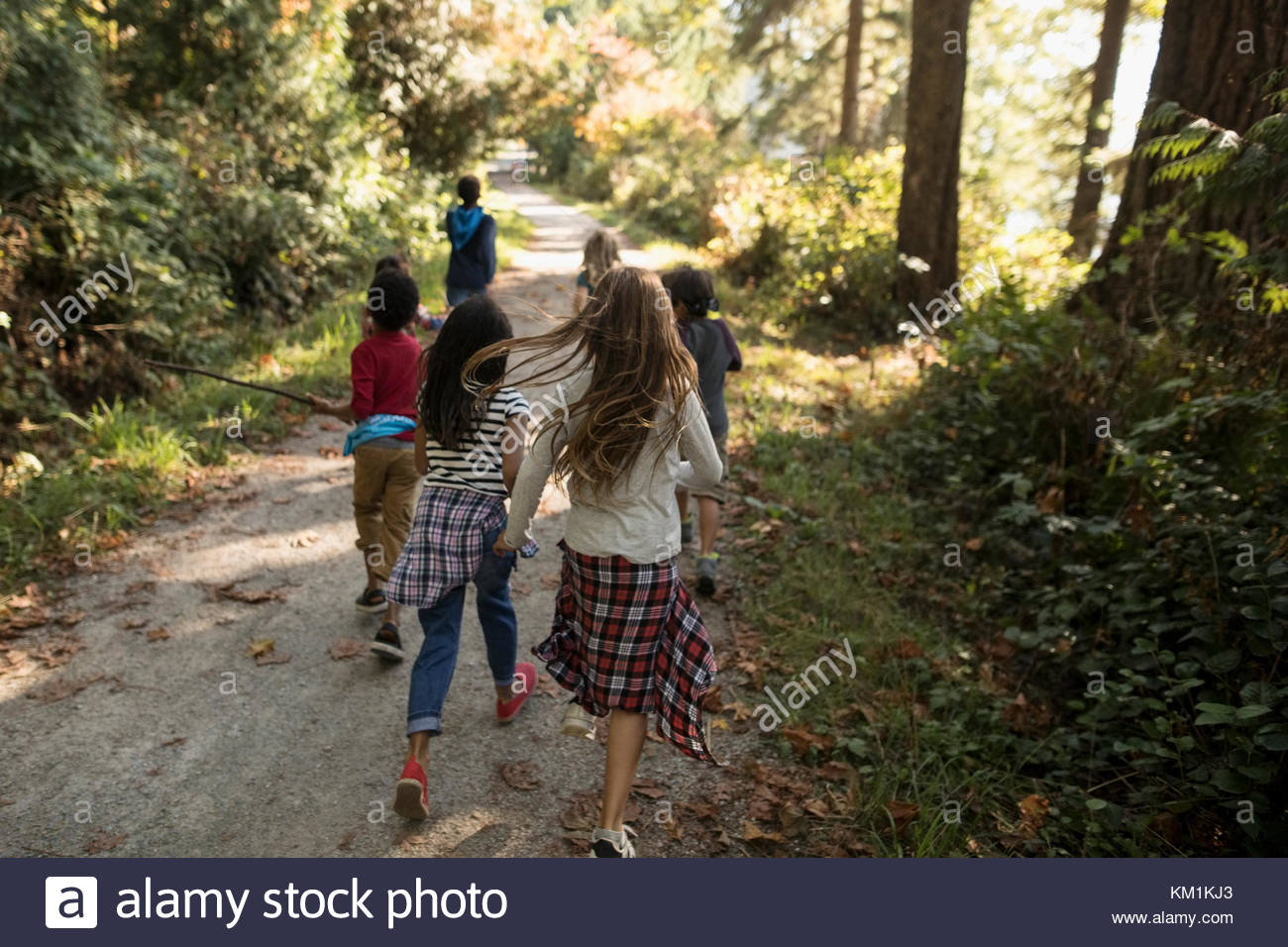 Boy and girl walking together hi-res stock photography and images - Alamy