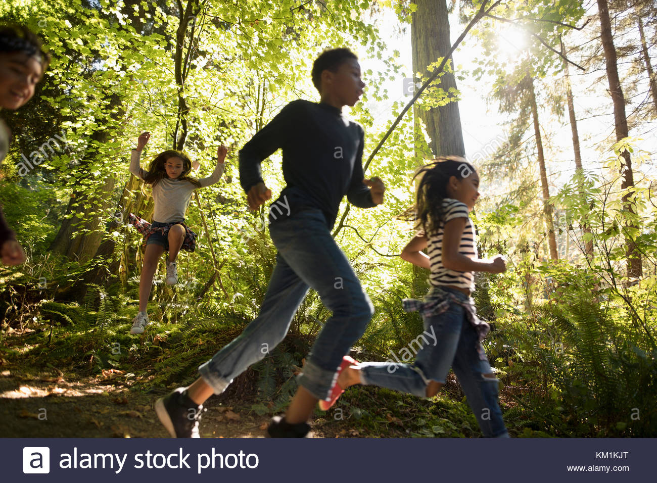 Boy girl running in forest hi-res stock photography and images - Alamy